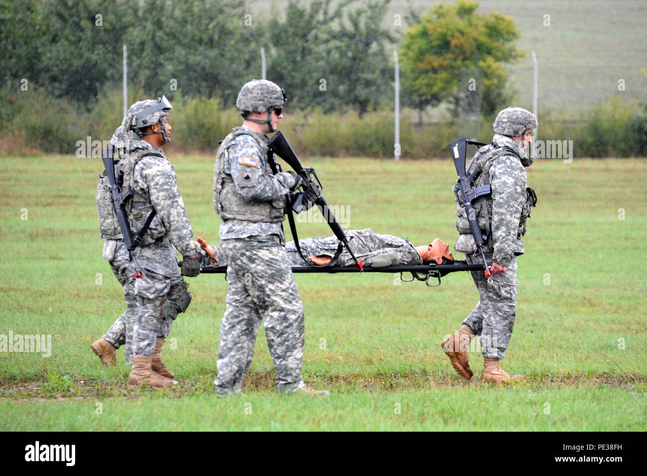 U.S. Soldiers assigned to 102nd Signal Battalion conduct a litter ...