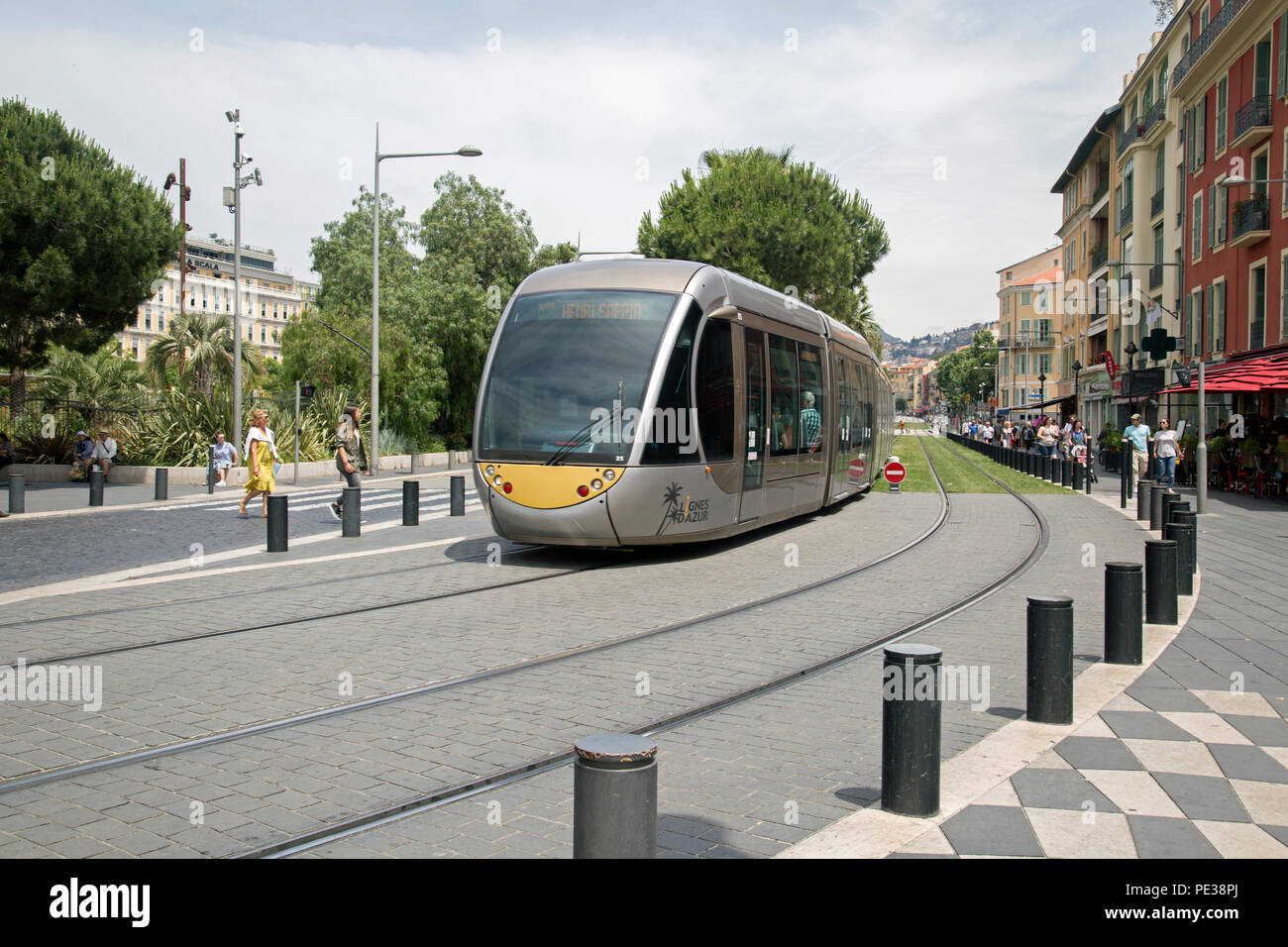 Nice, France,June 2018, A tram comes around a bend on a bright day ...