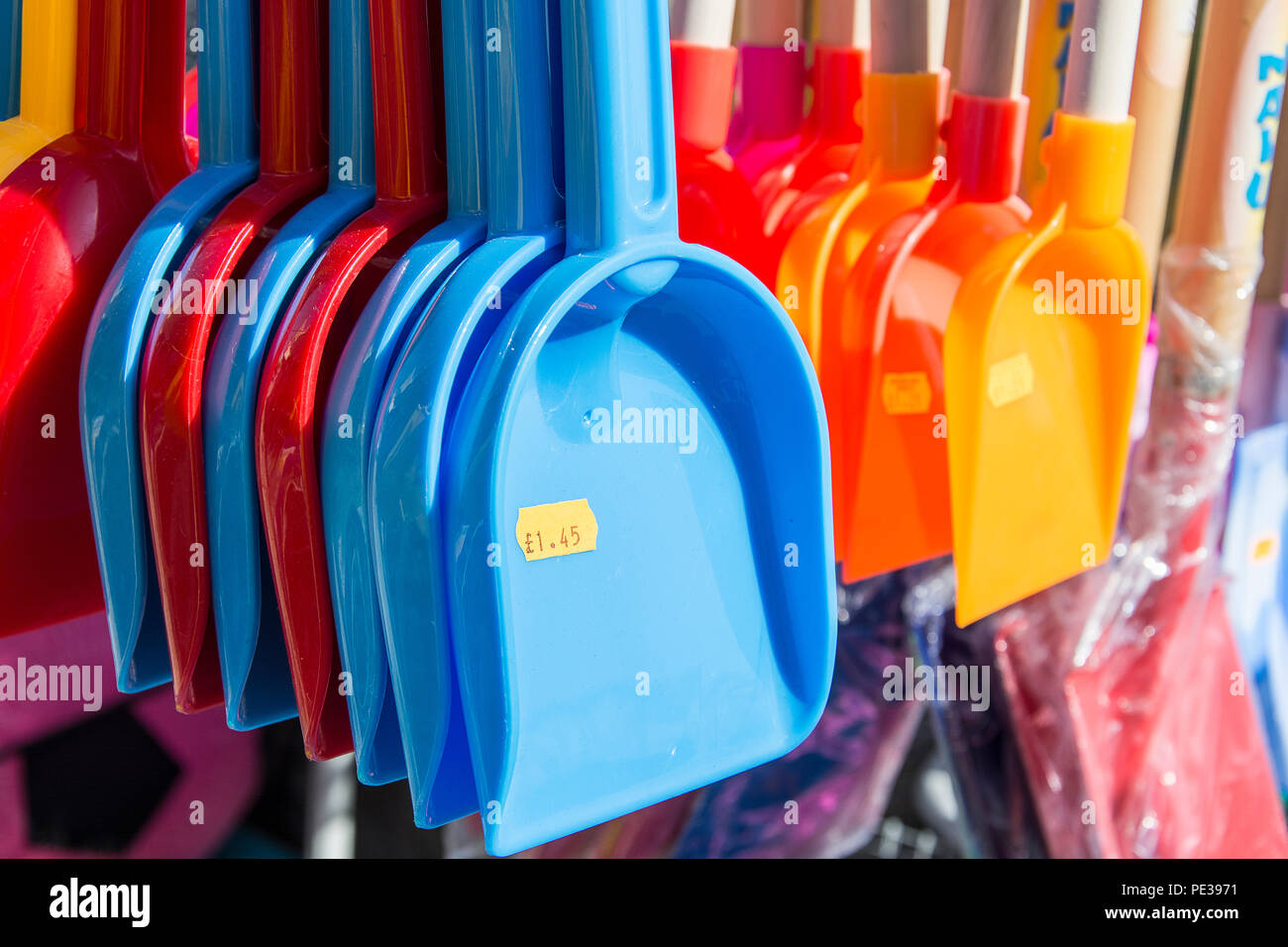 children's plastic spades for sale at local shop Stock Photo - Alamy