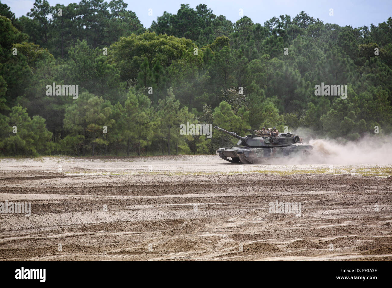 Marines with Alpha Company, 2nd Tank Battalion, proceed to a berm in an ...