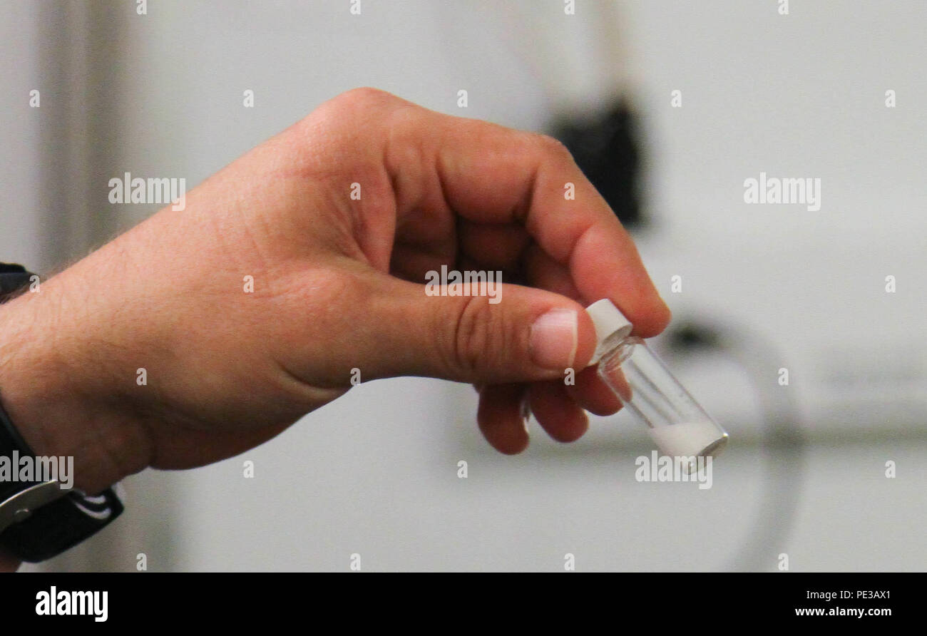 A small sample of an unidentified inert powder is used to show how a ...