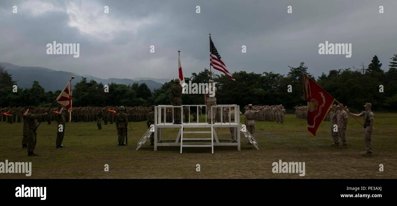 Japan Ground Self- Defense Force members and Marines salute ...