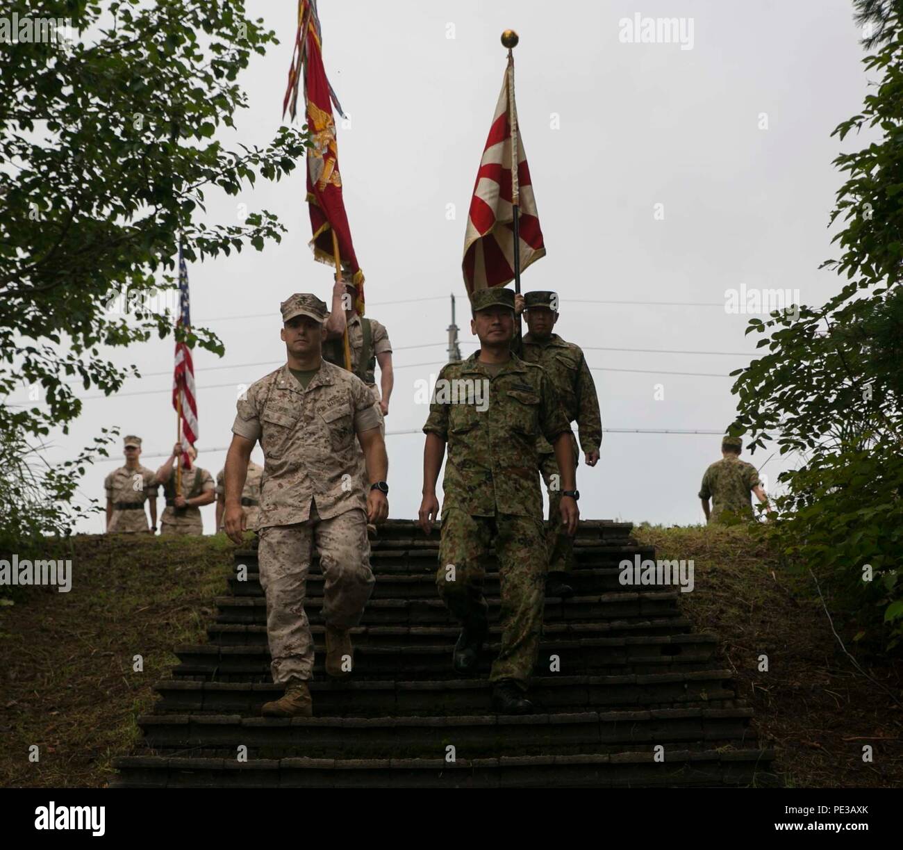 Col. Tadisha Tanida, right, descends the steps alongside U.S. Marine ...