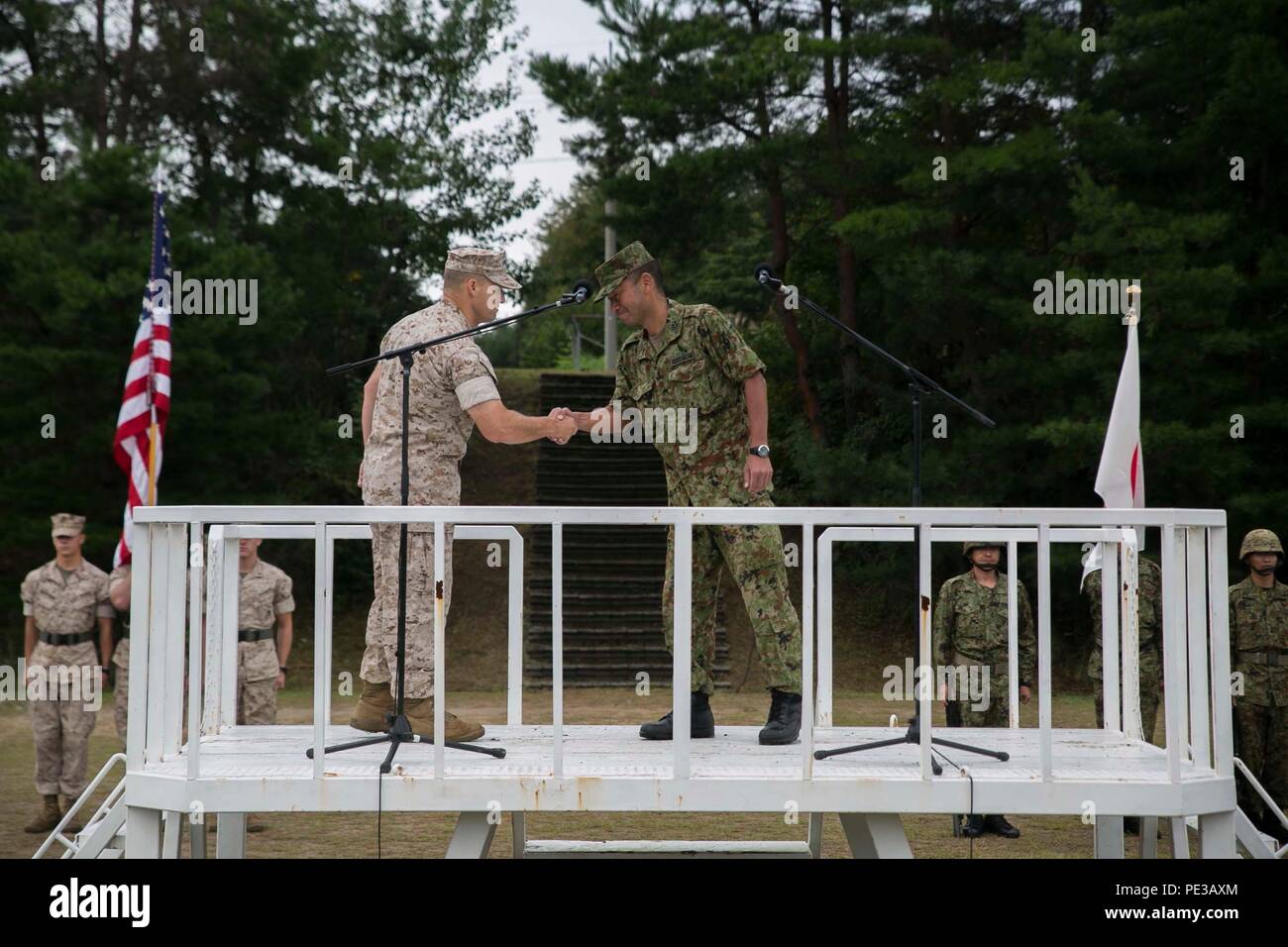 Col. Tadisha Tanida, right, shakes hands with U.S. Marine Corps Lt. Col ...