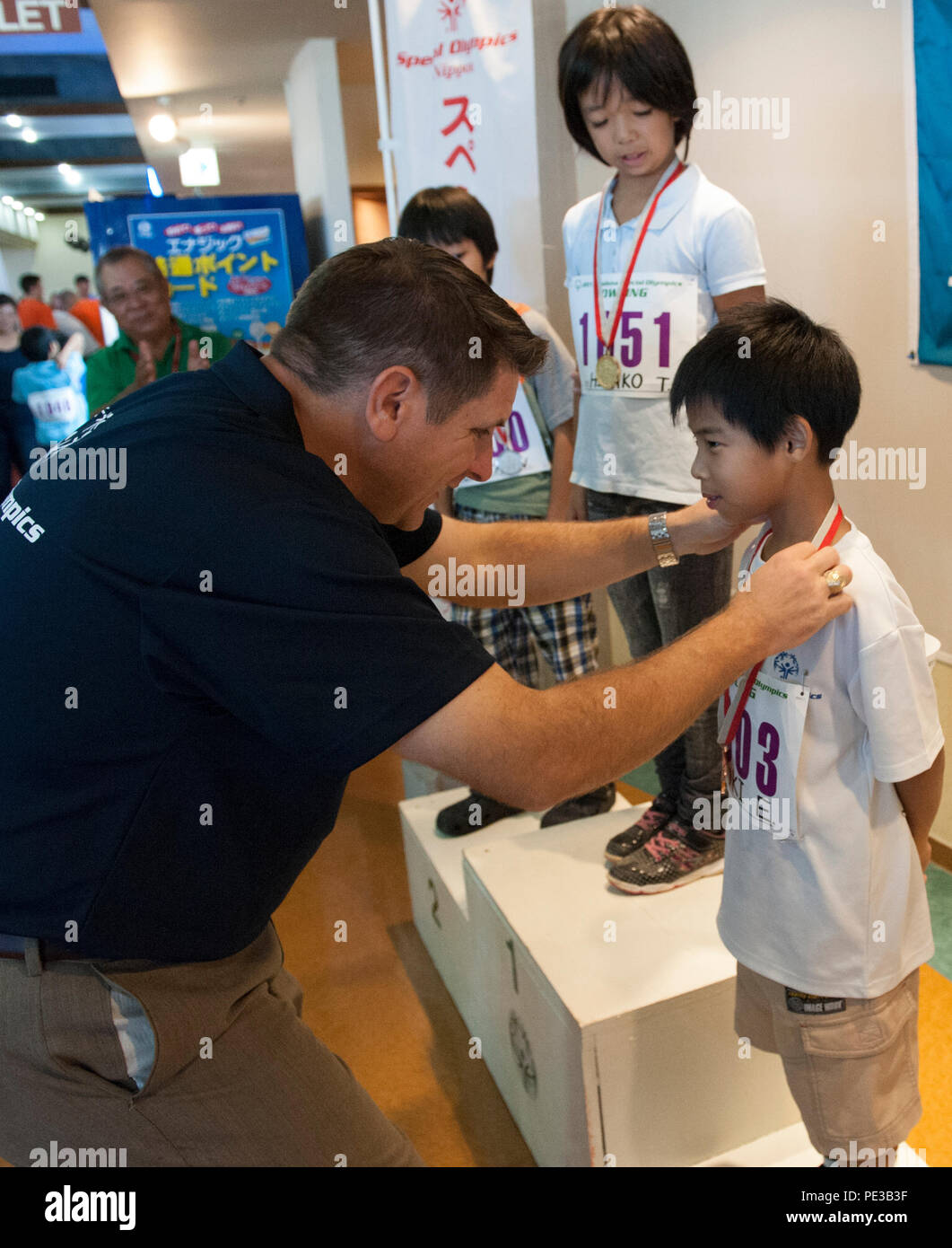 U.S. Air Force Col. Christopher Amrhein, 18th Wing vice commander, puts ...