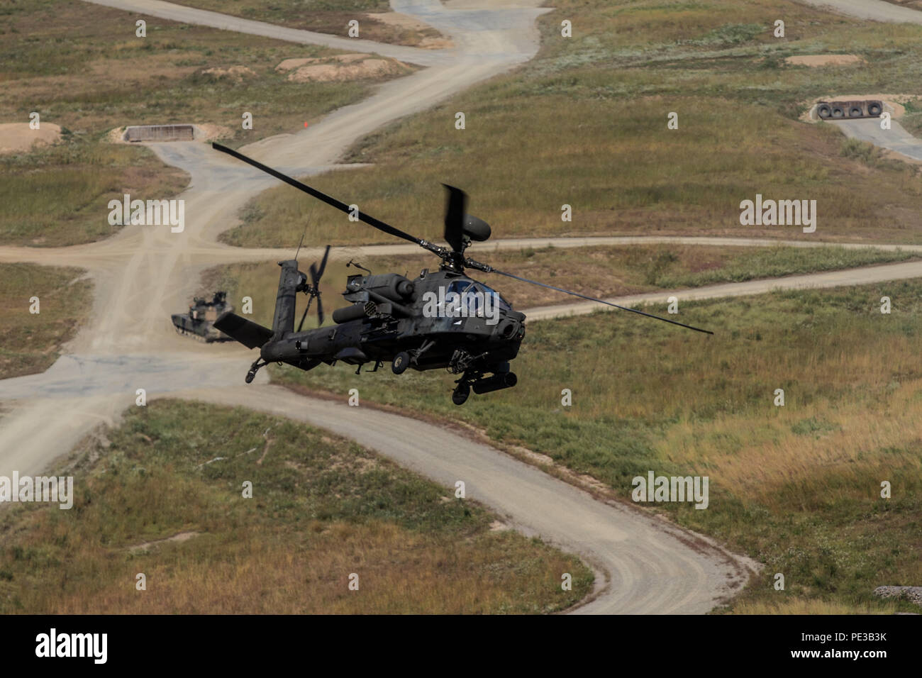 An AH-64 Apache augmented to the 2nd Battalion, 2nd Aviation Regiment ...