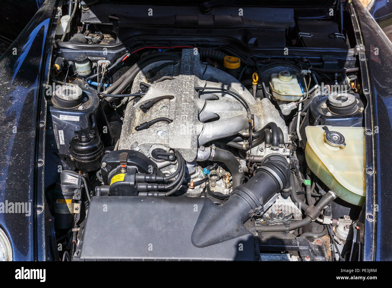 Open bonnet (hood) of a vintage Porsche 968 and the 3 litre straight ...
