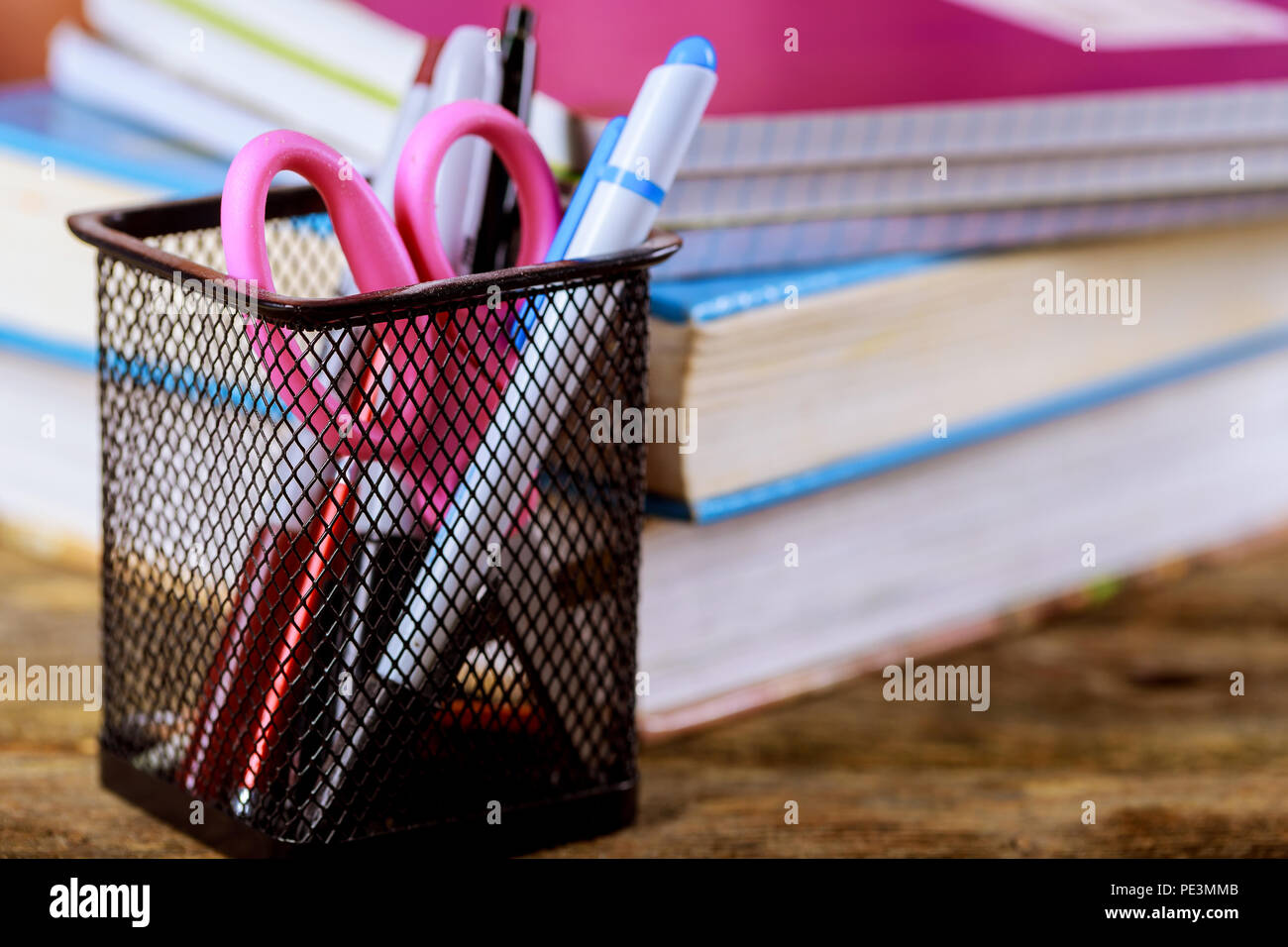School supplies with books Pile of Books with Color Pencils, A wood ...