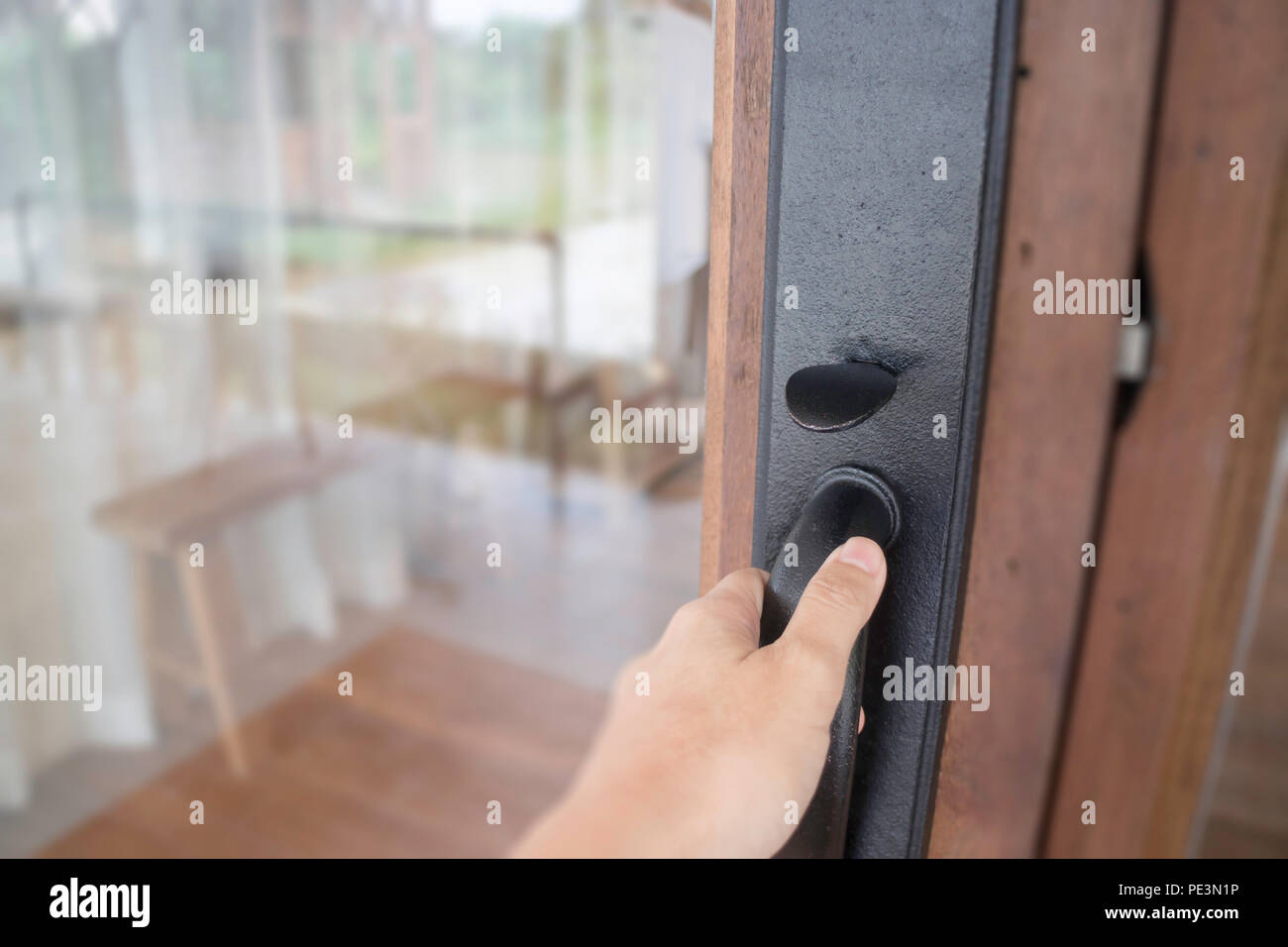 Hand opening see through door, stock photo Stock Photo - Alamy