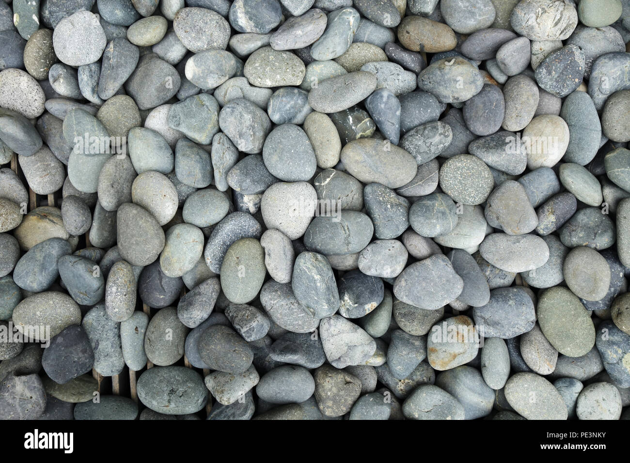 Naturally polished white and gray rock pebbles background Stock Photo ...