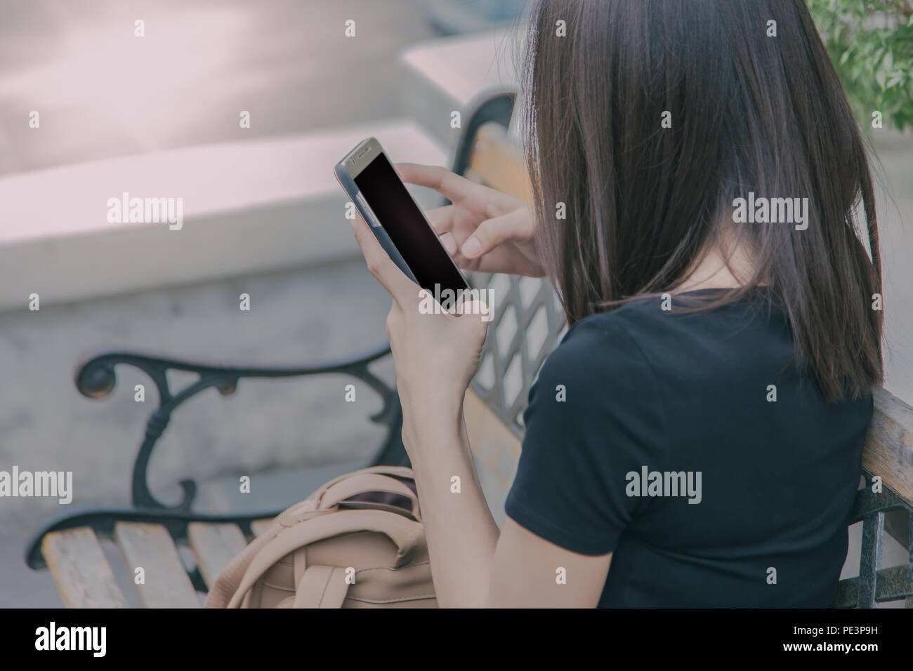 Girl using mobile phone selfies in places outdoors happily Stock Photo ...