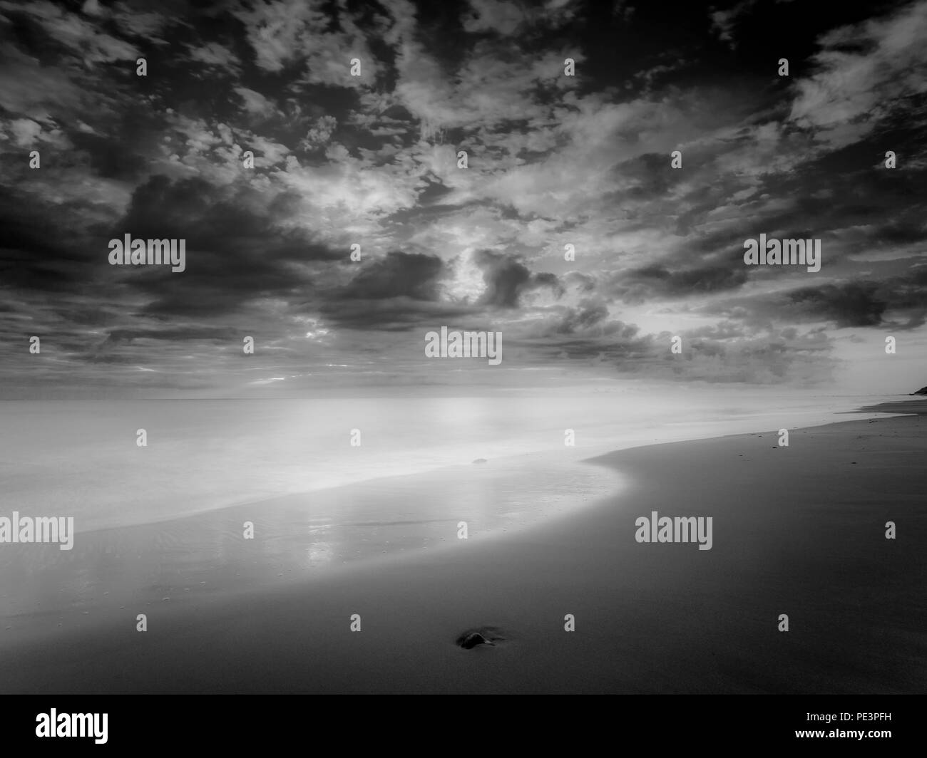 Pebble sandy beach Black and White Stock Photos & Images - Alamy