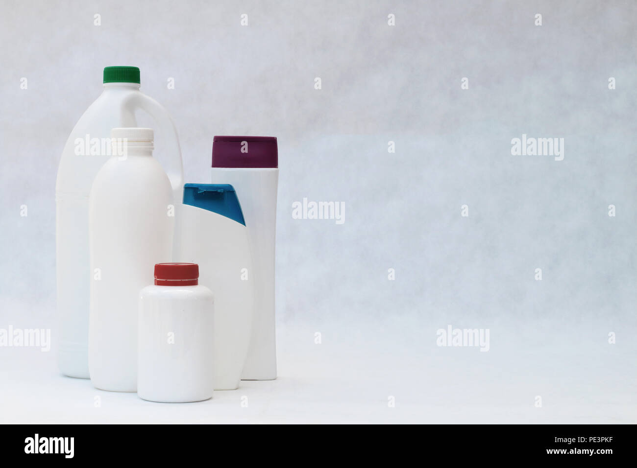 Plastic containers of different shapes and colors Stock Photo - Alamy