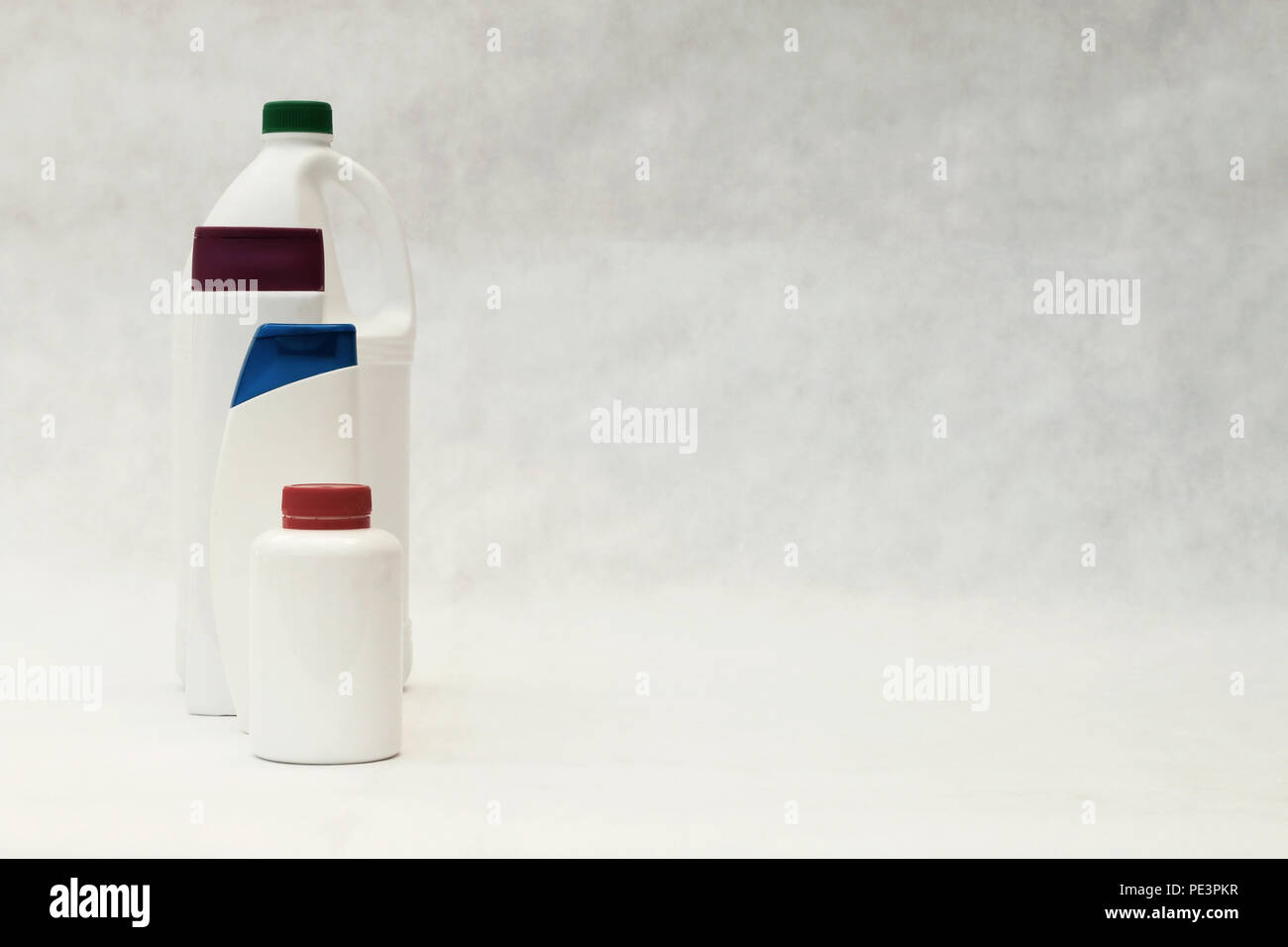 Plastic containers of different shapes and colors Stock Photo - Alamy