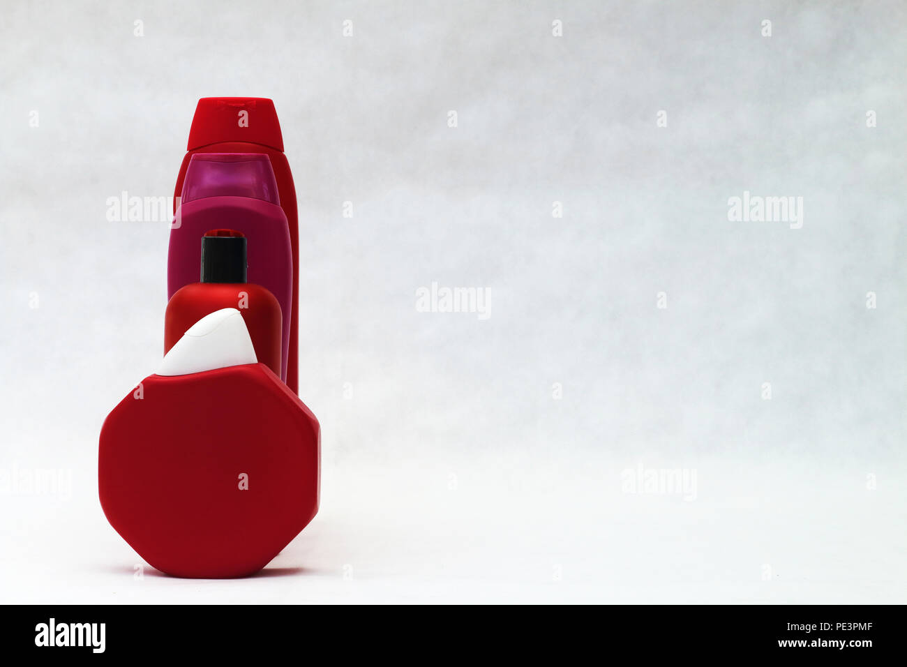 Plastic containers of different shapes and colors Stock Photo - Alamy