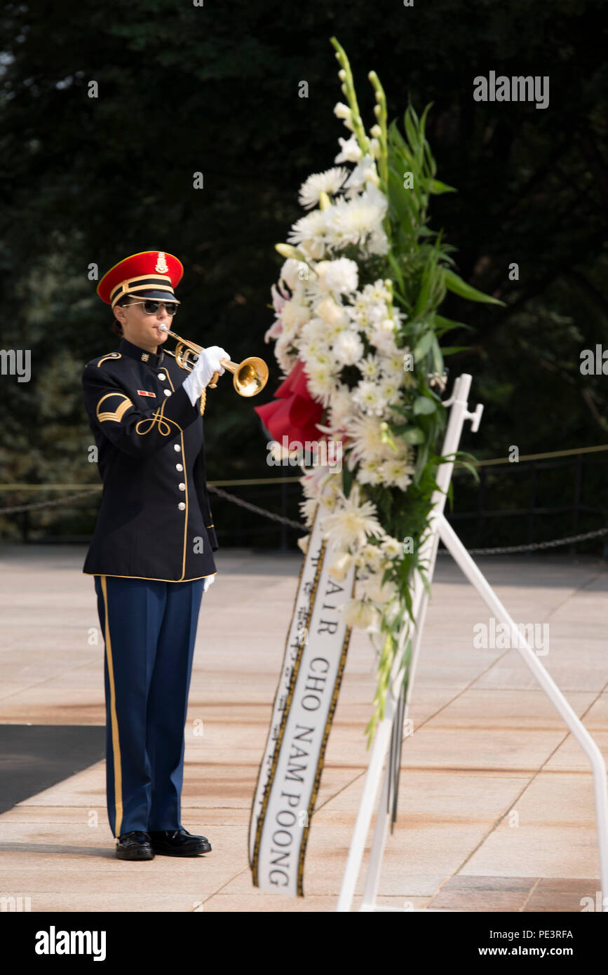 A bugler from The U.S. Army Band, “Pershing’s Own,” plays taps during a ...