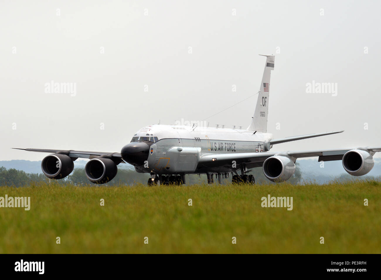 An RC-135S Cobra Ball taxis toward the end of the runway to prepare for ...