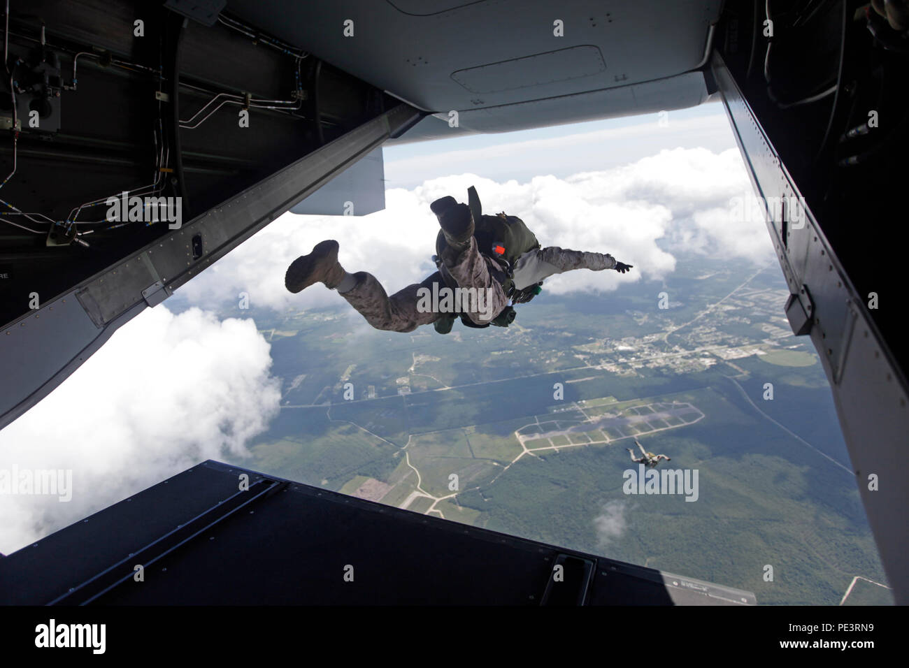 U.S. Marines with Marine Raider Regiment, conduct a free-fall jump from ...