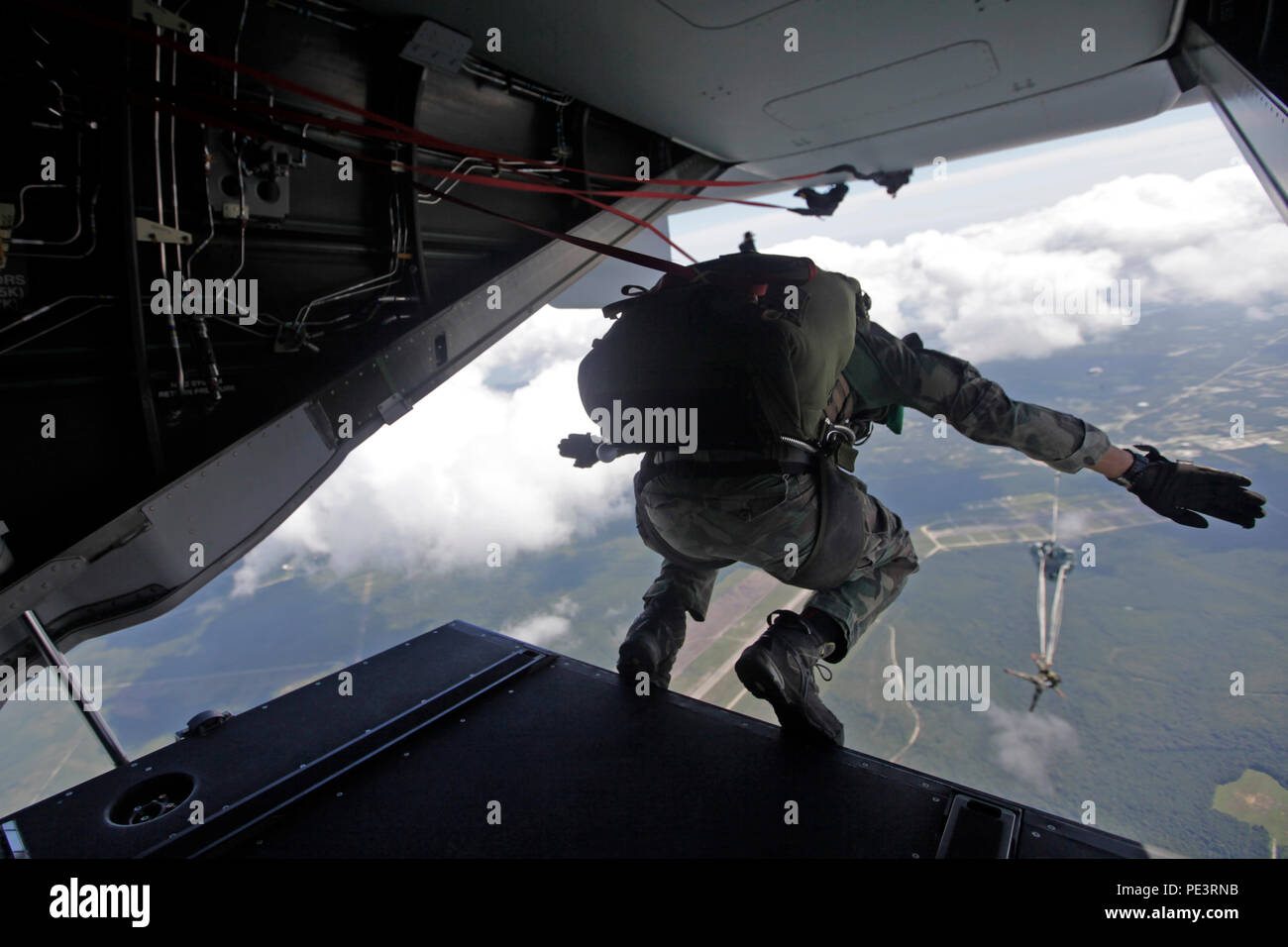 A U.S. Marine with Marine Raider Regiment, conducts a free-fall jump ...