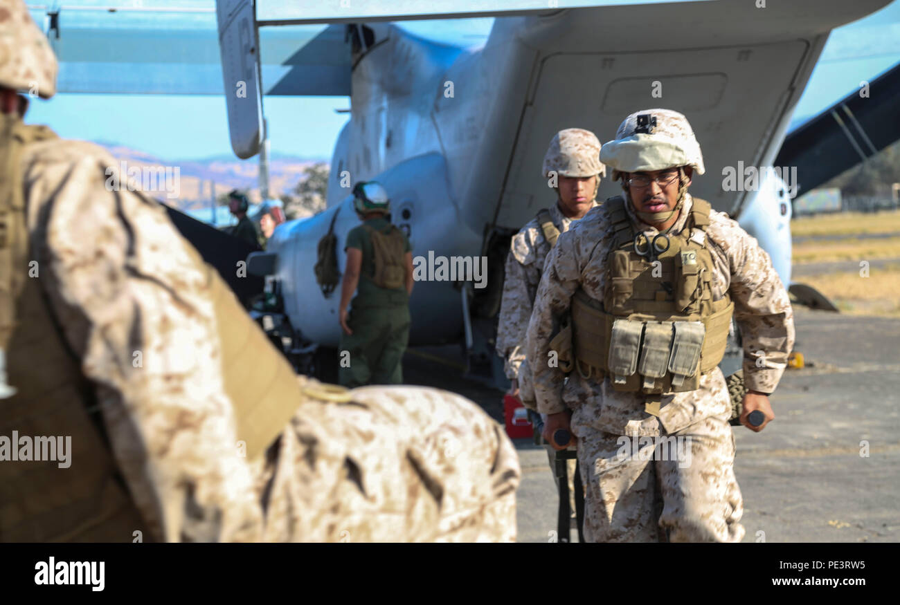 Petty Officer 2nd Class Phillip Lopez (front) and Seaman Jordan Saco, U ...