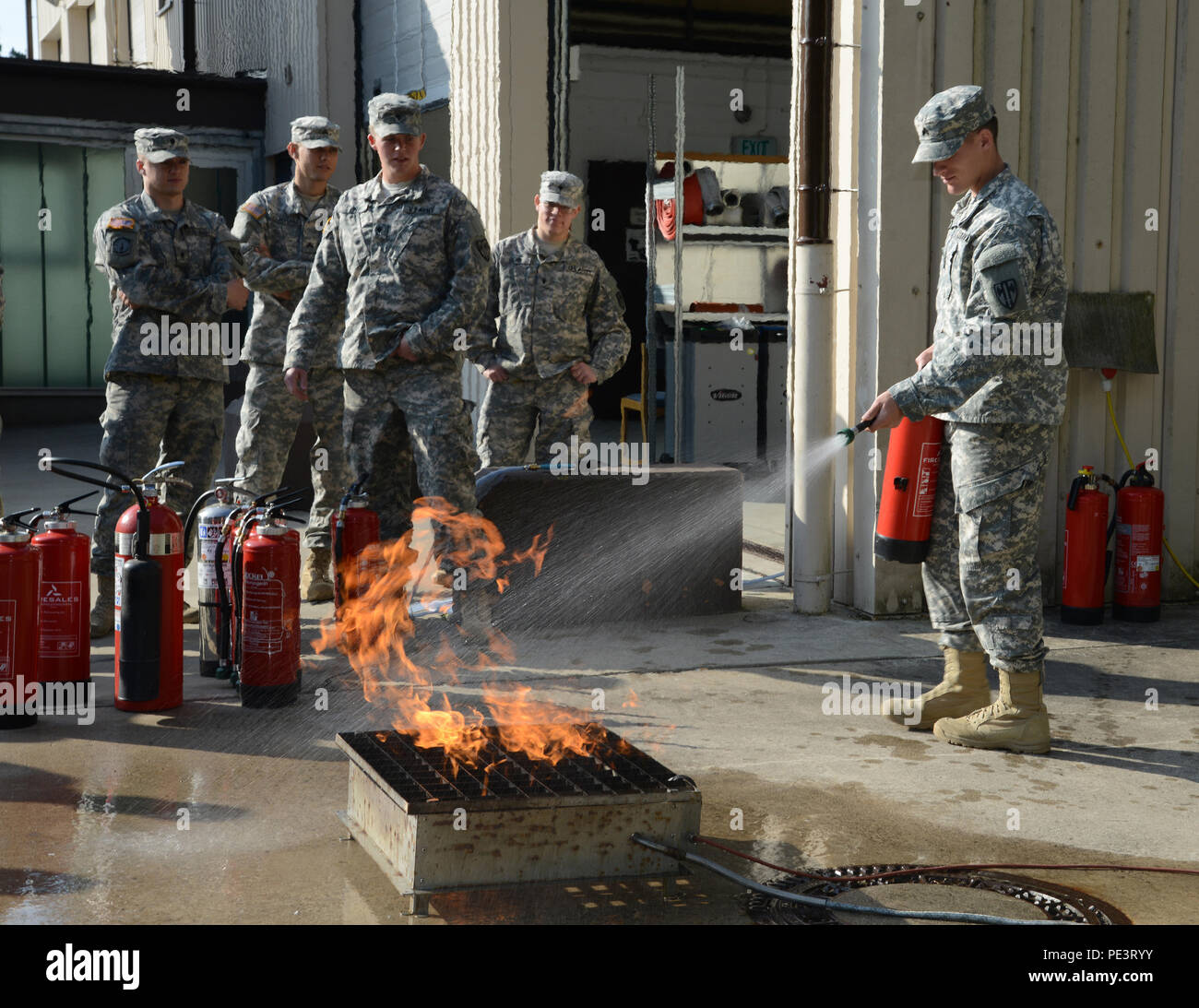 U.S. Army Sgt. Deavon Renfro, 92d Military Police Company, extinguishes ...