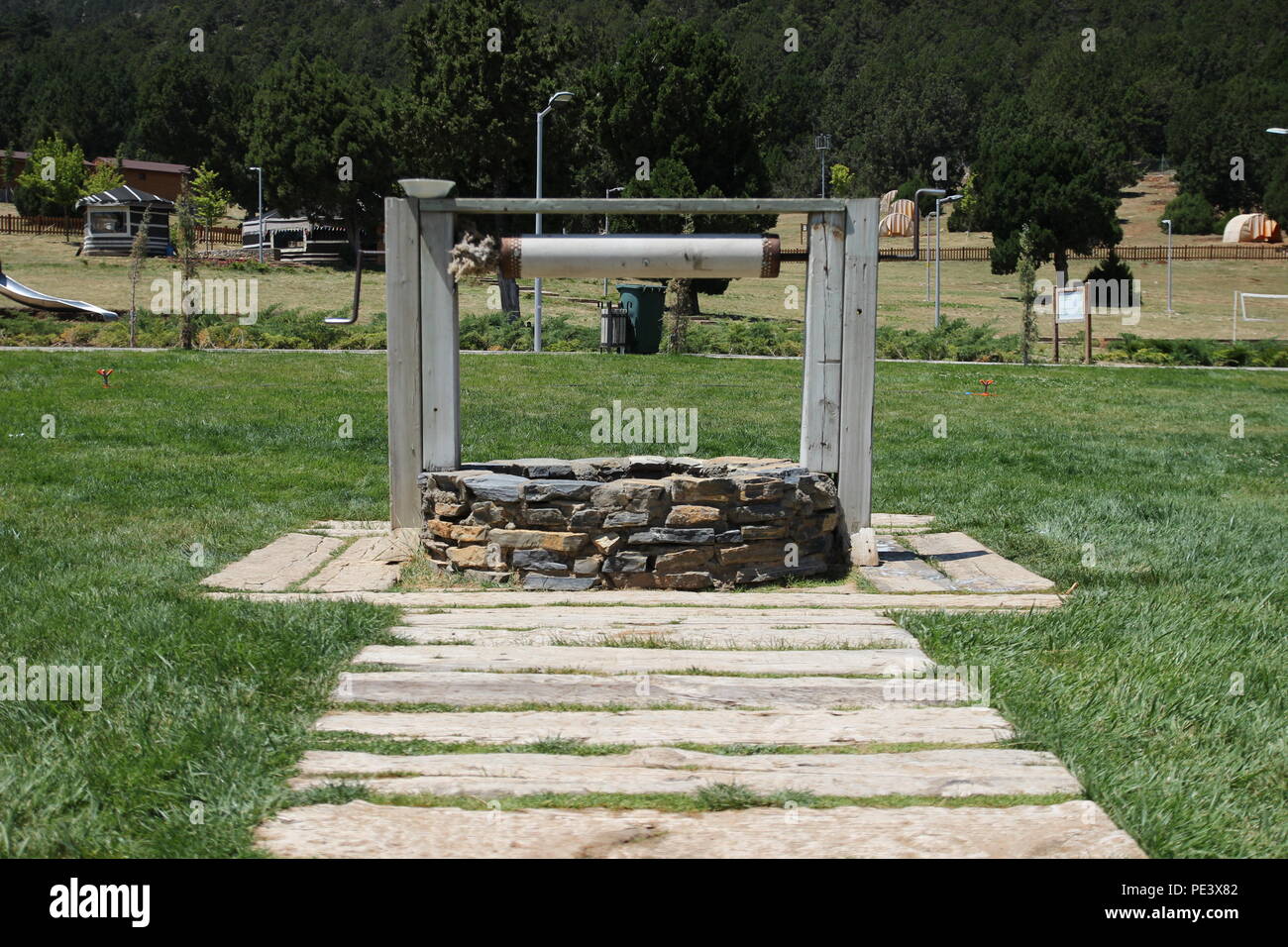 stone wall water well Stock Photo - Alamy