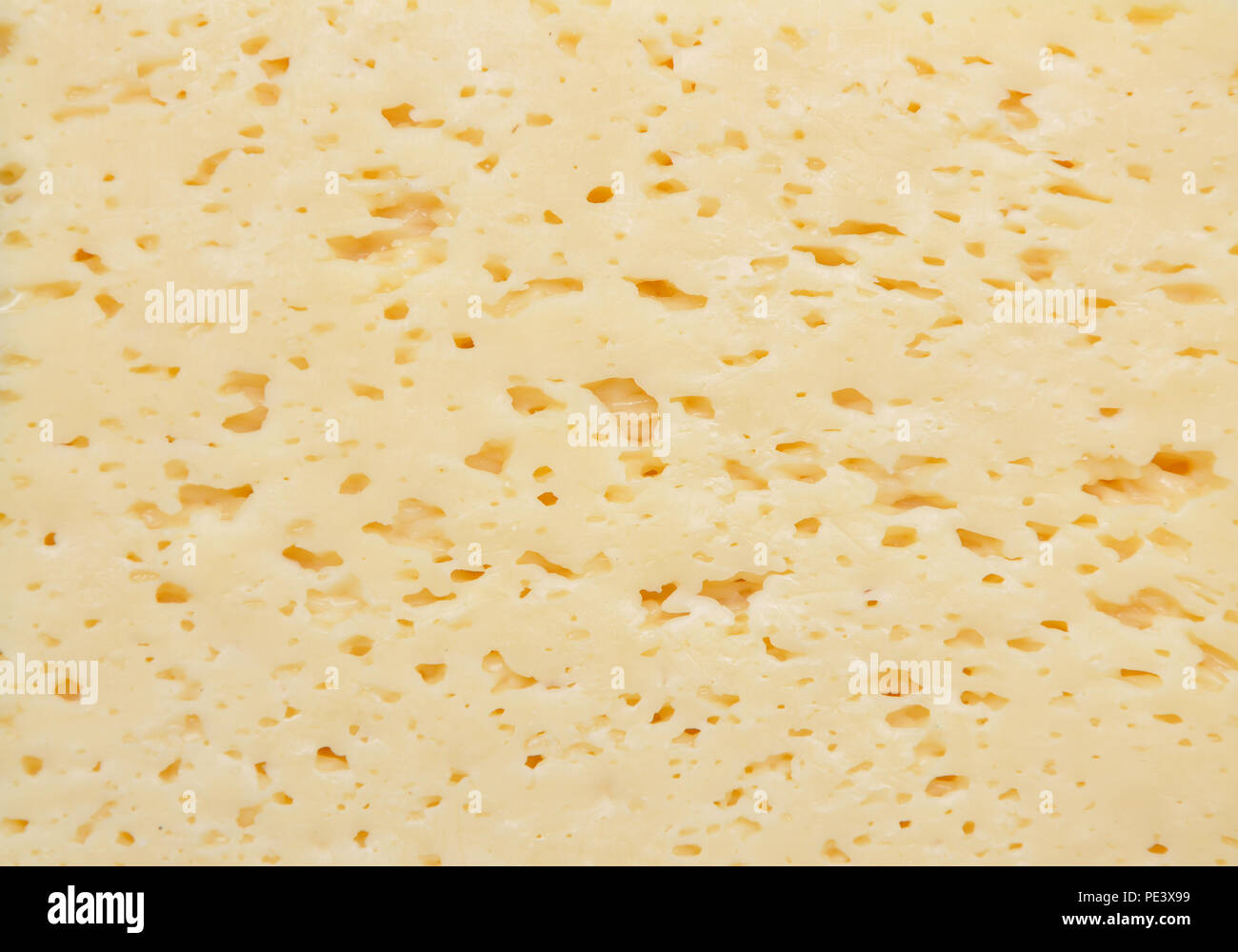 Cheese cut background horizontal Stock Photo - Alamy