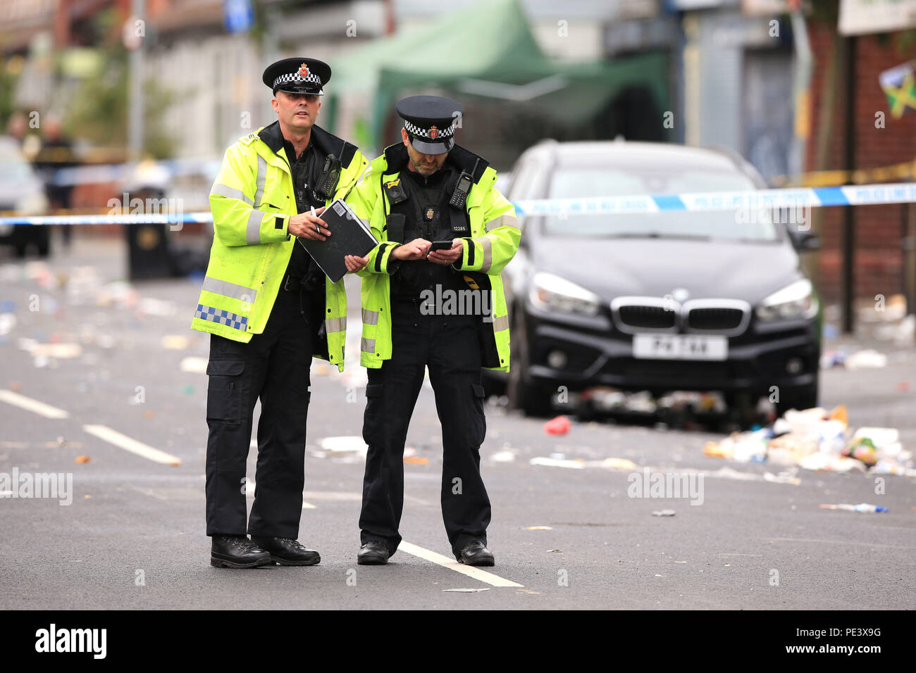 Police officers assess scene hi-res stock photography and images - Alamy