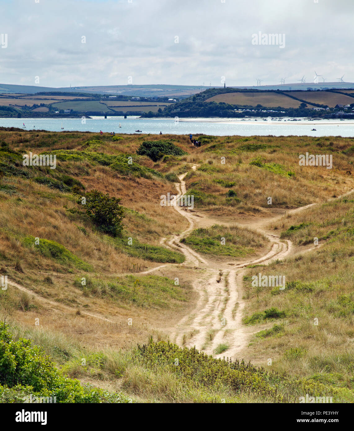 A path through sand dunes near Rock, Cornwall looks like a highway road ...