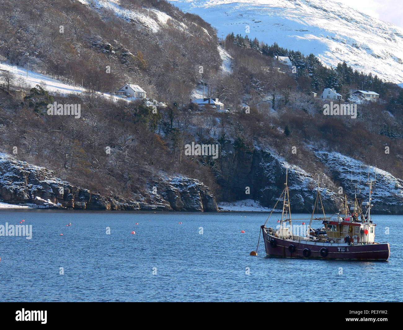 Artisanal crab fishing vessels anchored in winter in the harbour of ...