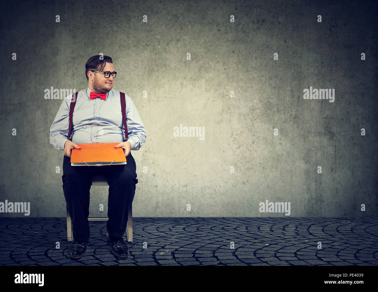 Overweight man sitting on chair hi-res stock photography and images - Alamy