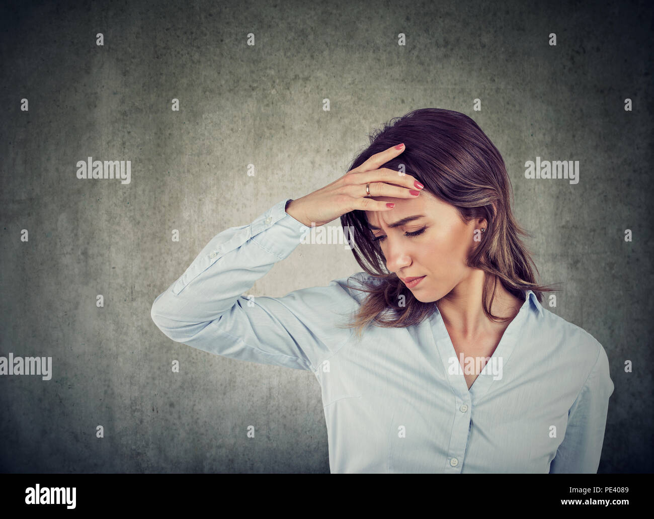 Closeup portrait of a sad young beautiful woman with worried stressed ...