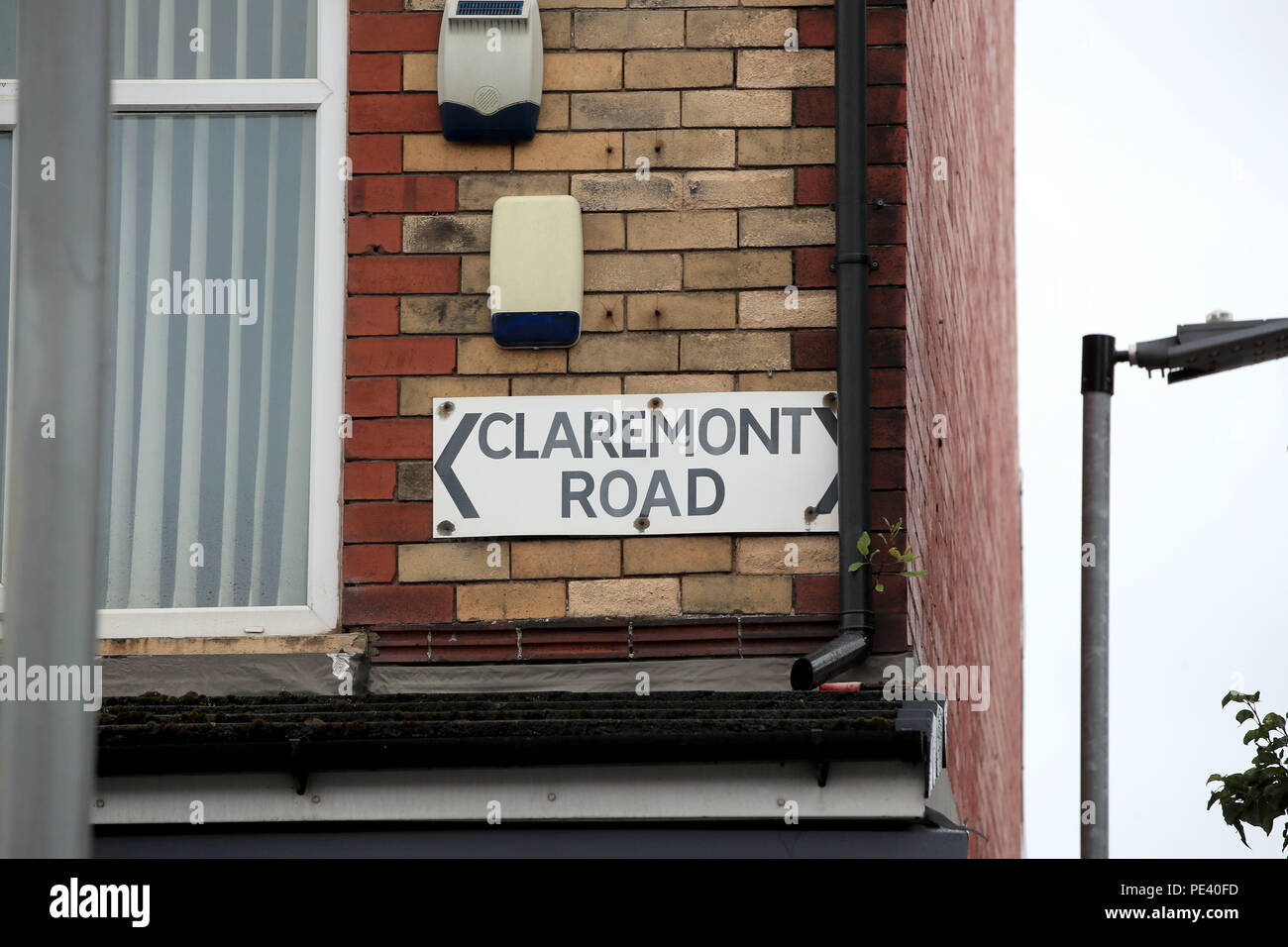 The street sign of Claremont Road, Moss Side, Manchester, where armed ...