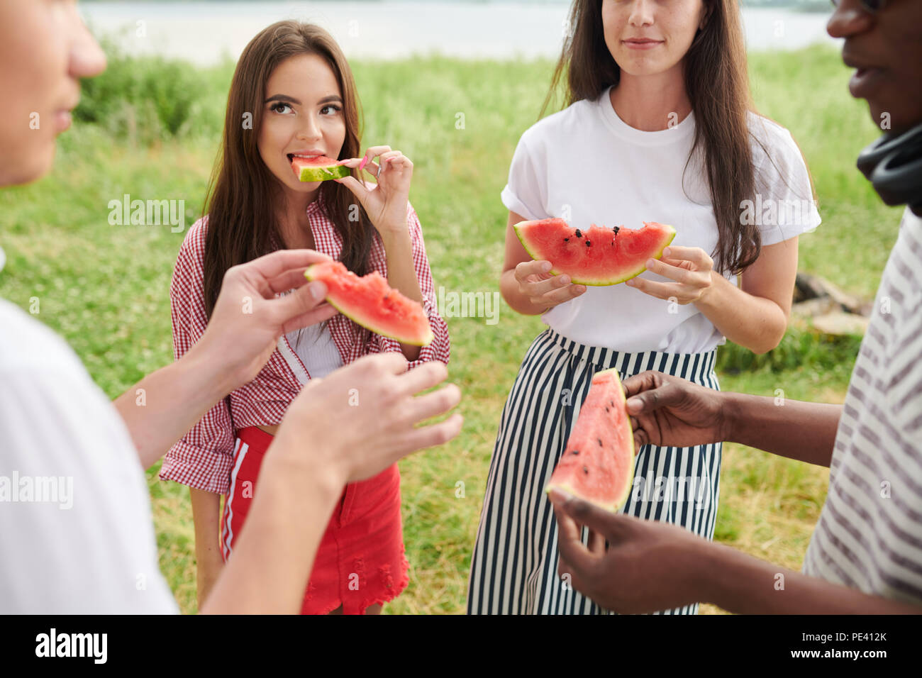 Group of people eating fruit hi-res stock photography and images - Alamy
