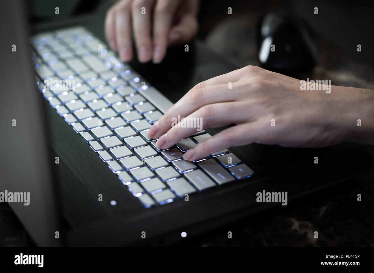 Hands typing on keyboard Stock Photo - Alamy