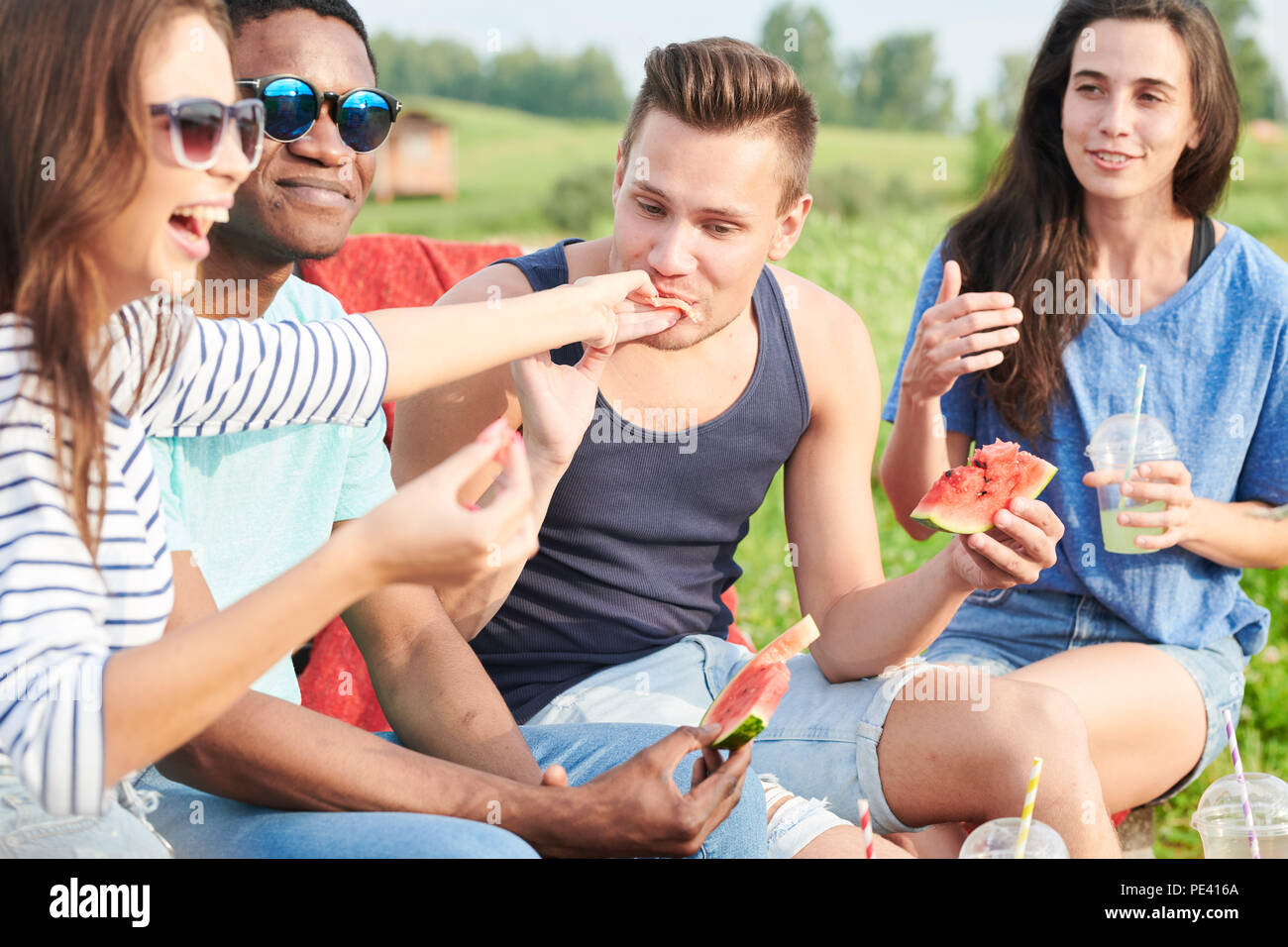 Group of people eating fruit hi-res stock photography and images - Alamy