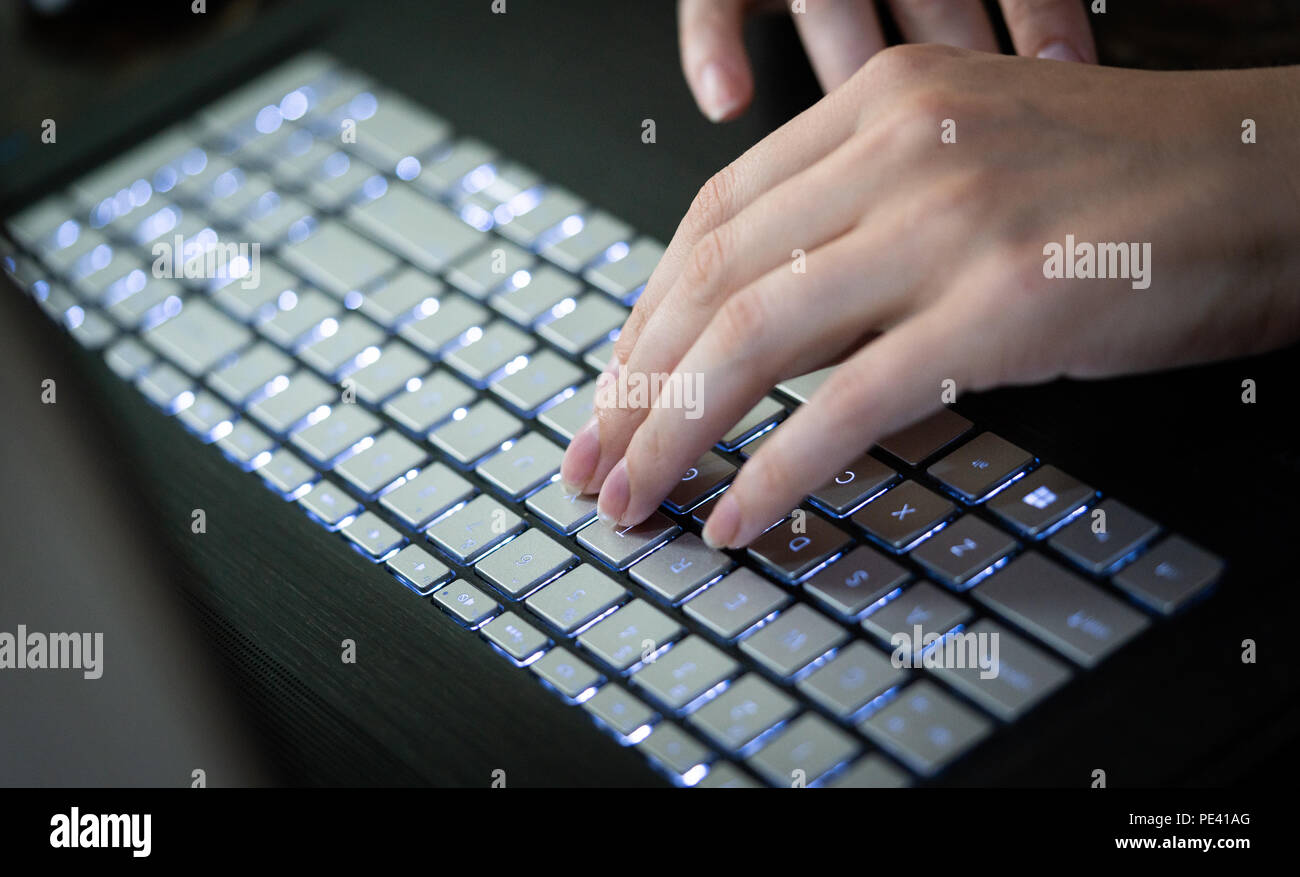 Hands typing on keyboard Stock Photo - Alamy