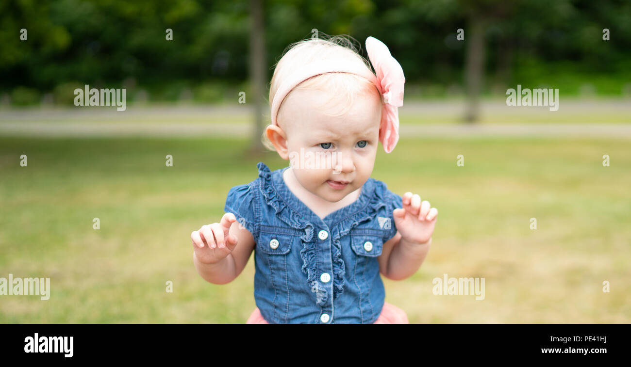 Baby girl first steps Stock Photo - Alamy