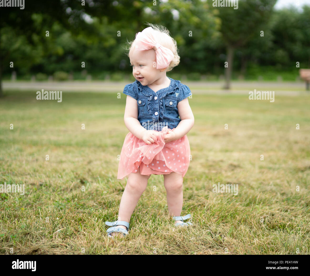 Baby girl first steps Stock Photo - Alamy