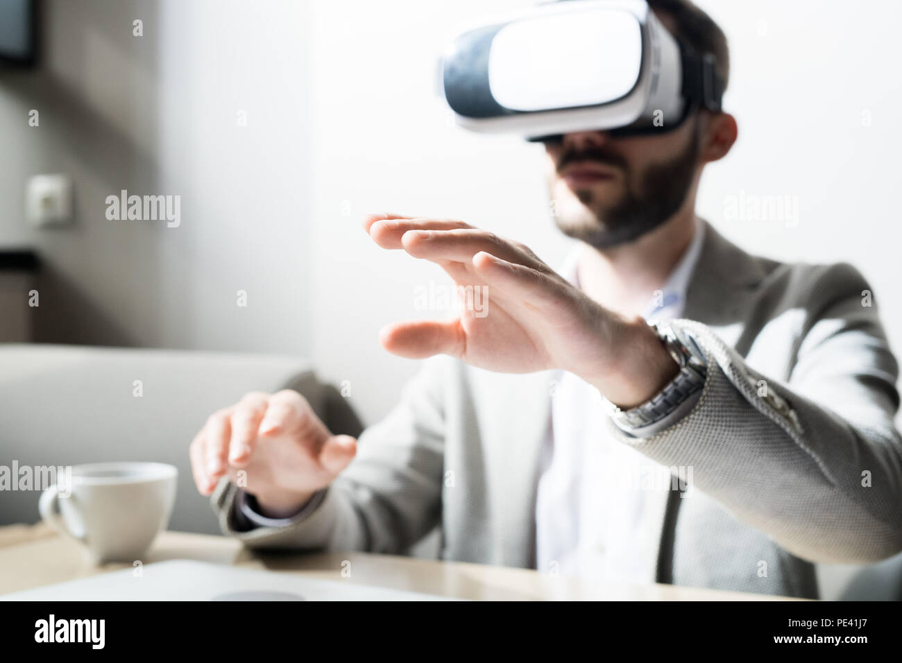 Man in VR headset Stock Photo - Alamy