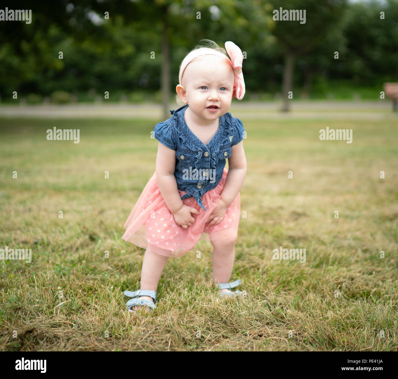 Baby girl first steps Stock Photo - Alamy