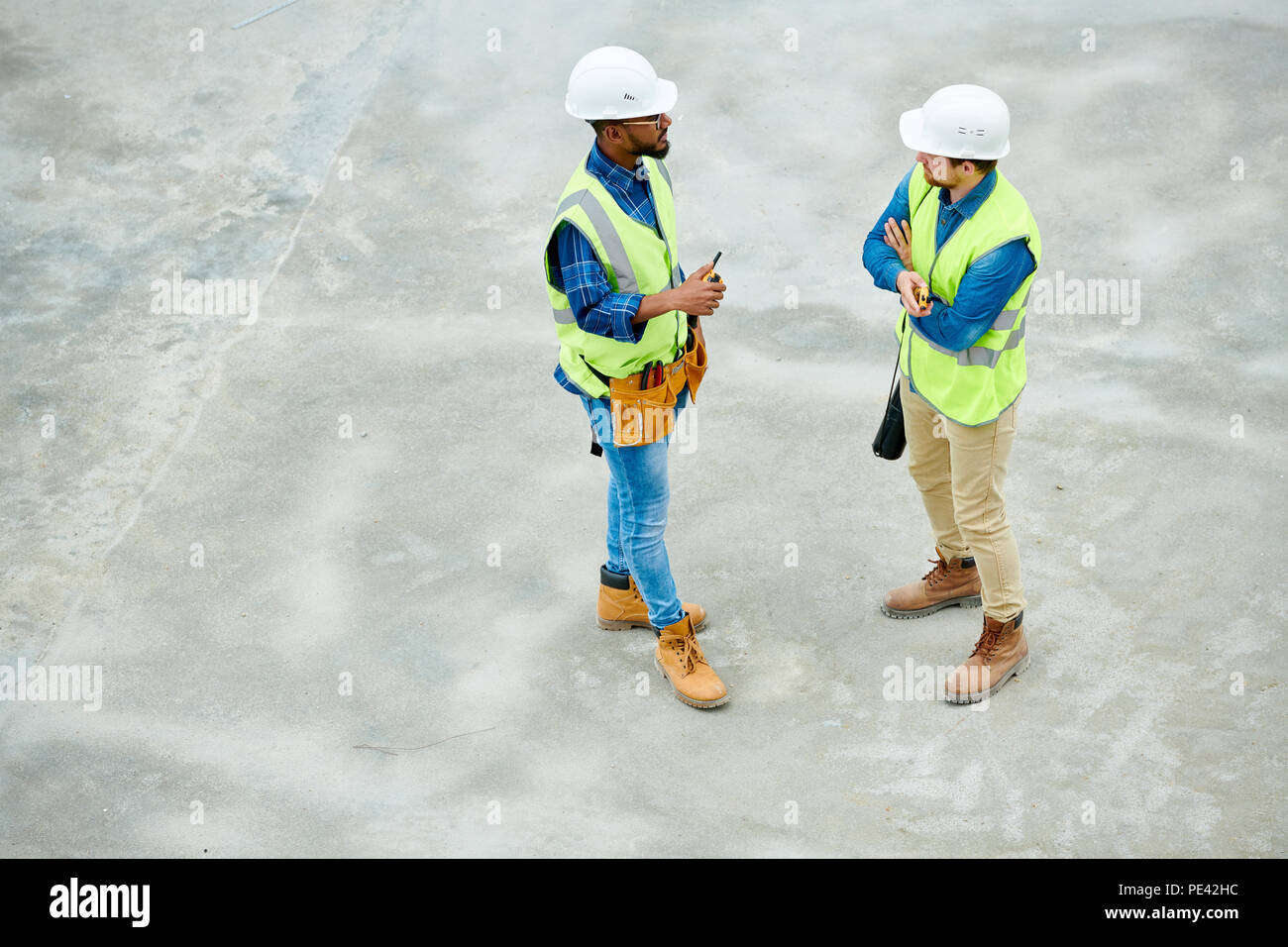 Male engineers talking construction project hi-res stock photography ...