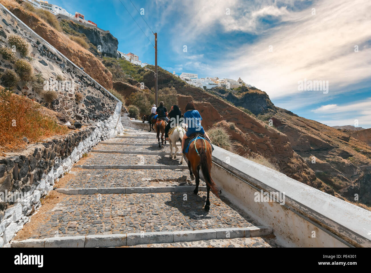 Tourists on donkeys climb the stairs, Fira, Santorini Stock Photo - Alamy