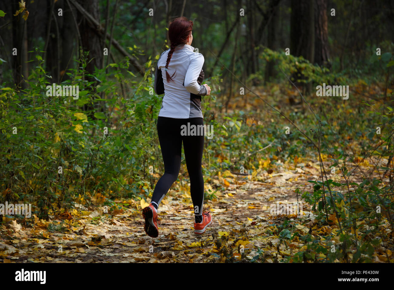 Back view woman running on hi-res stock photography and images - Alamy