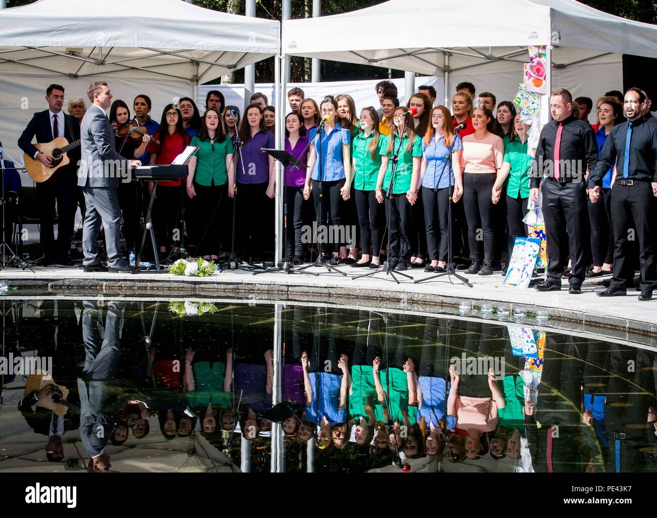 Omagh Community Choir preforming at the Memorial Gardens in Omagh to ...