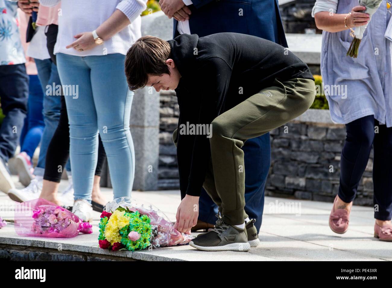 Lee Dillon lays flowers to remember his late uncle Oran Doherty at the ...