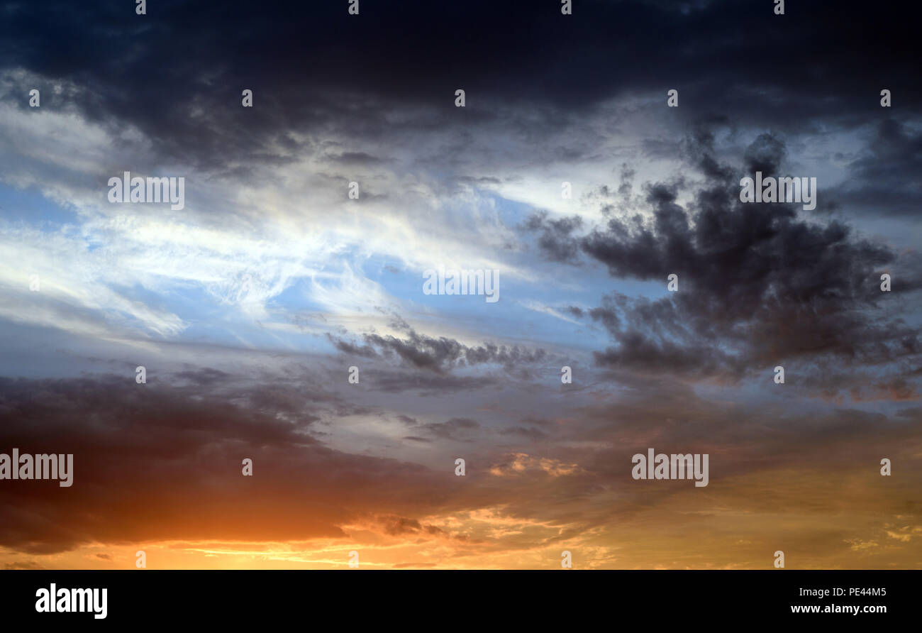 Dramatic stormy clouds with abeautiful amazing colors and a sunset with ...
