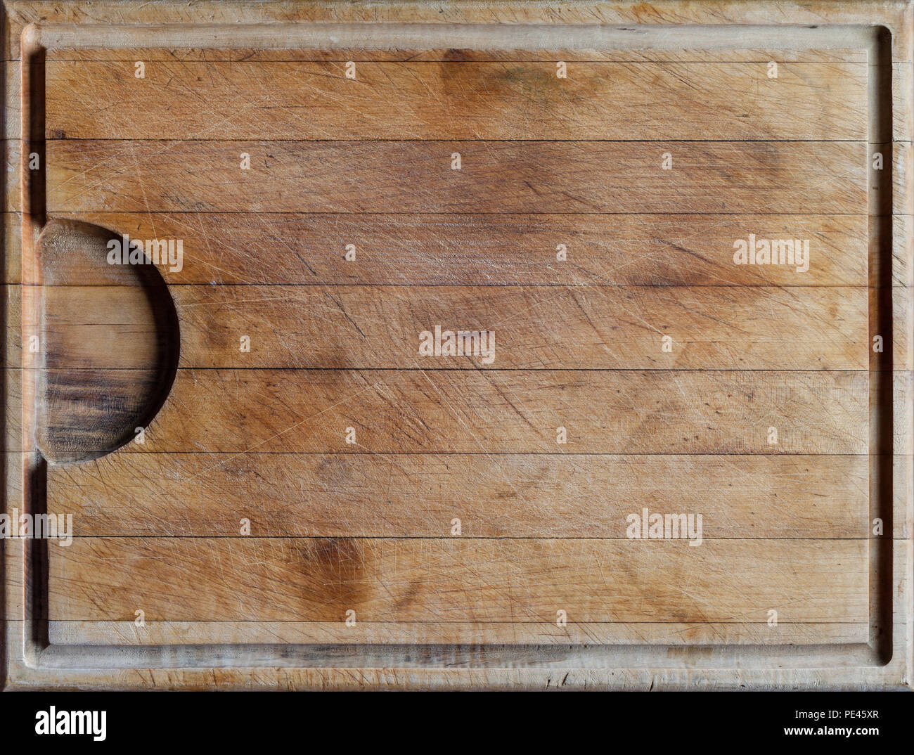Rough wooden rectangular used cutting board background with horizontal ...