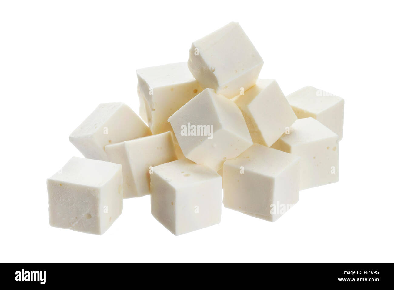 Heap of diced feta cubes isolated on white background Stock Photo - Alamy