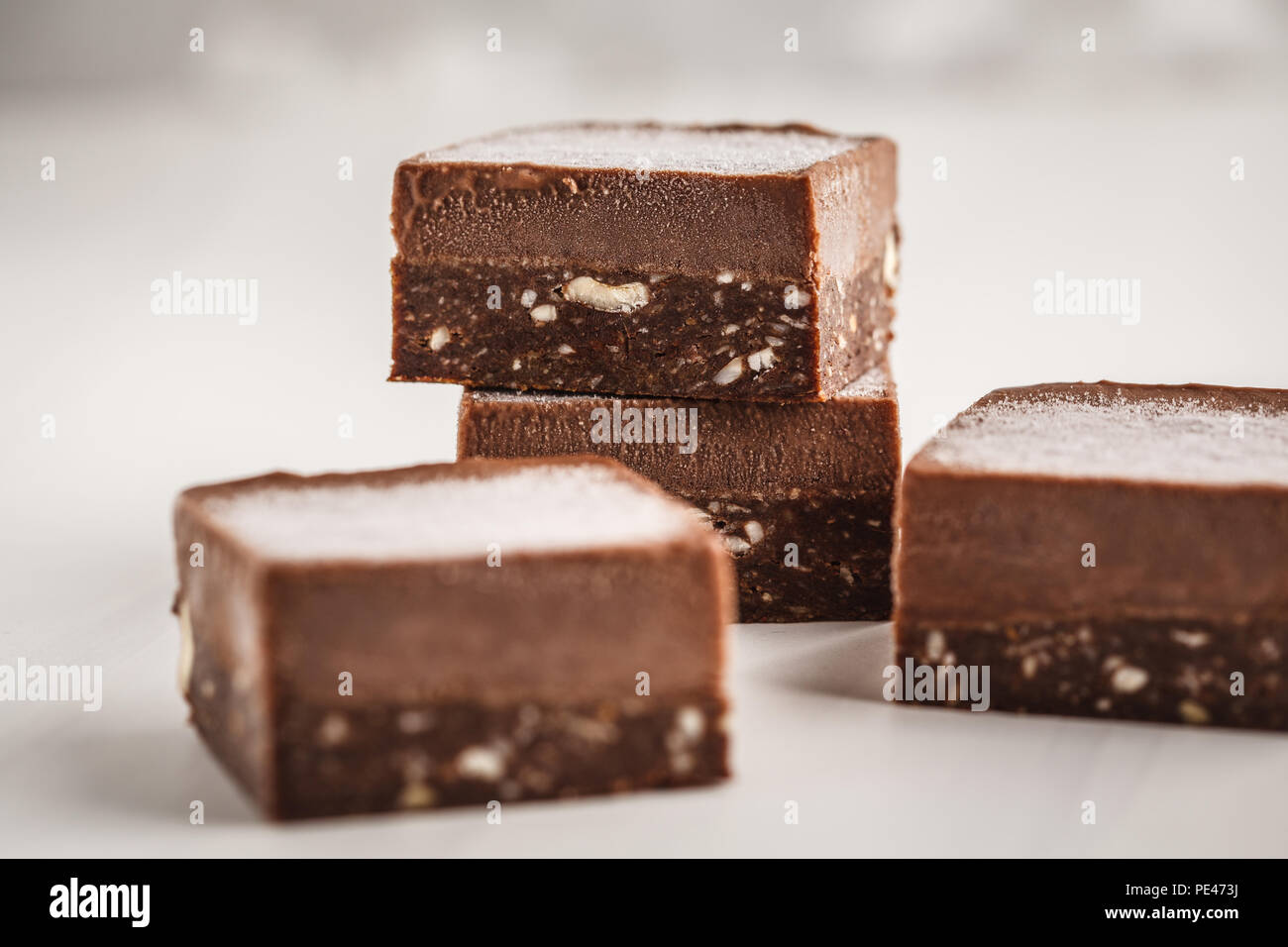 Chocolate fudge bars on white background. Clean eating concept. Raw ...